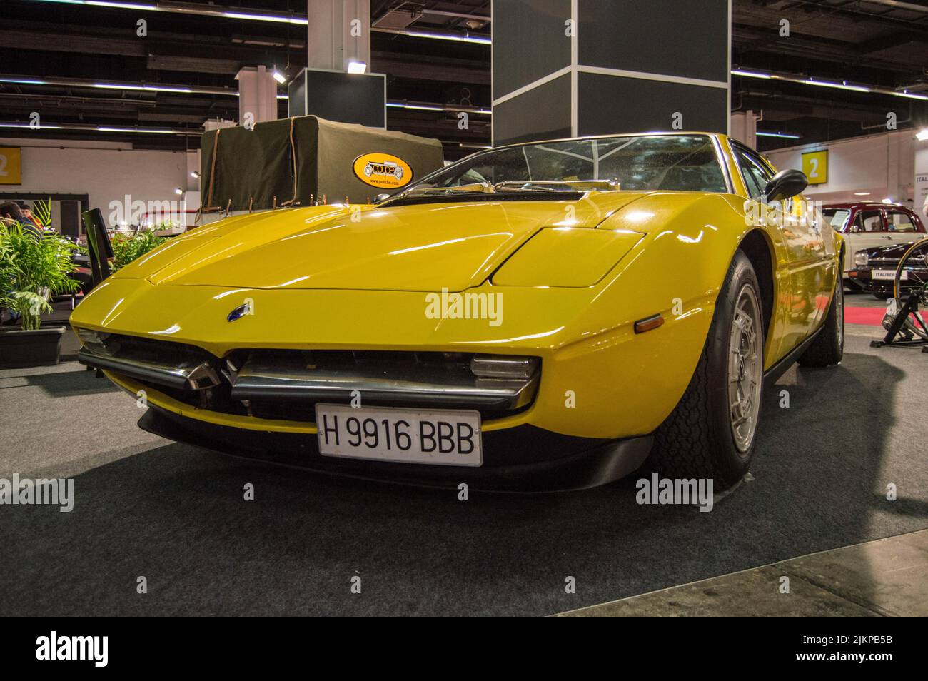 Old classic yellow car parked in the indoor expo, Maserati Merak Stock ...