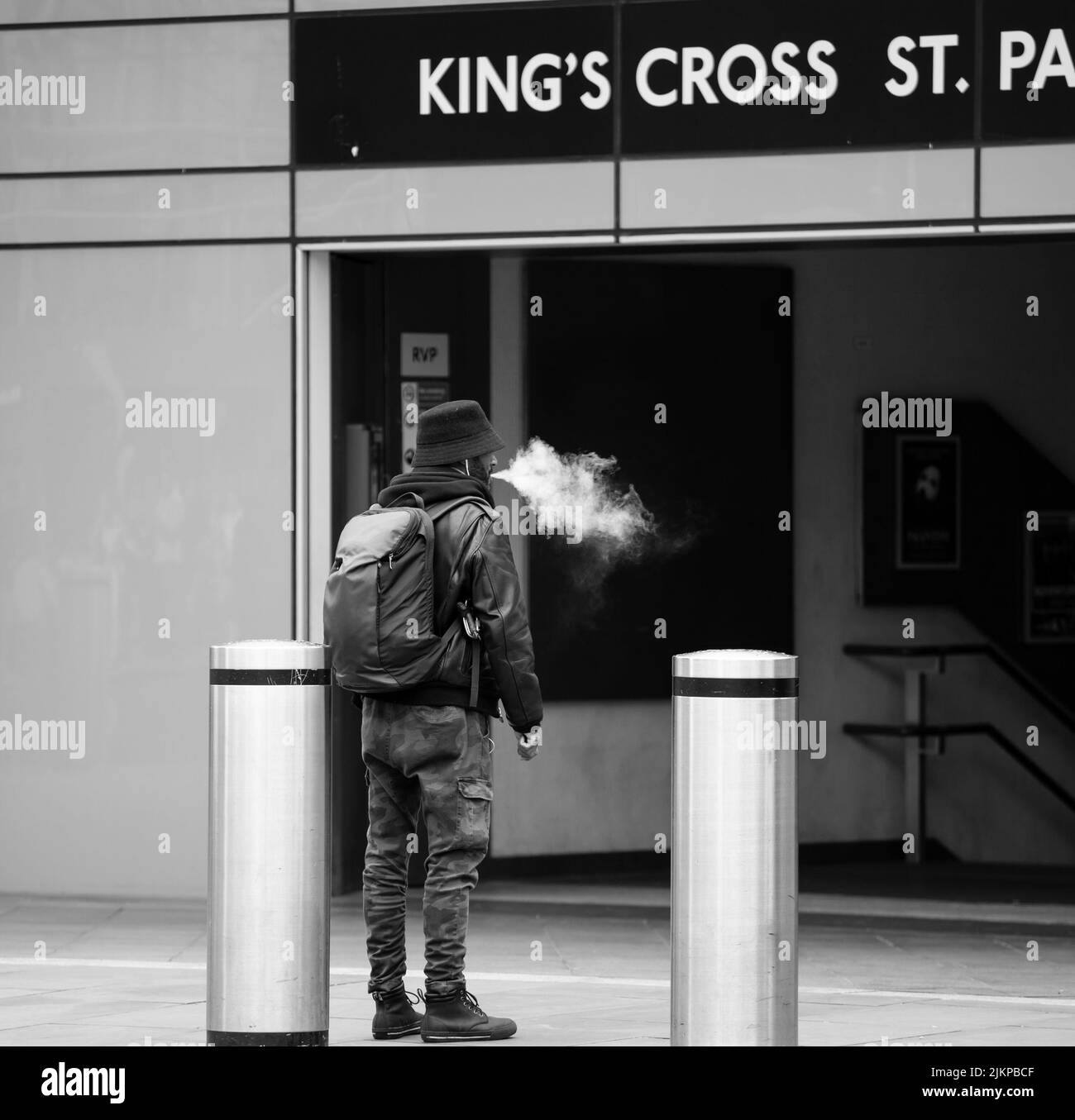 Man smoking standing hi-res stock photography and images - Alamy