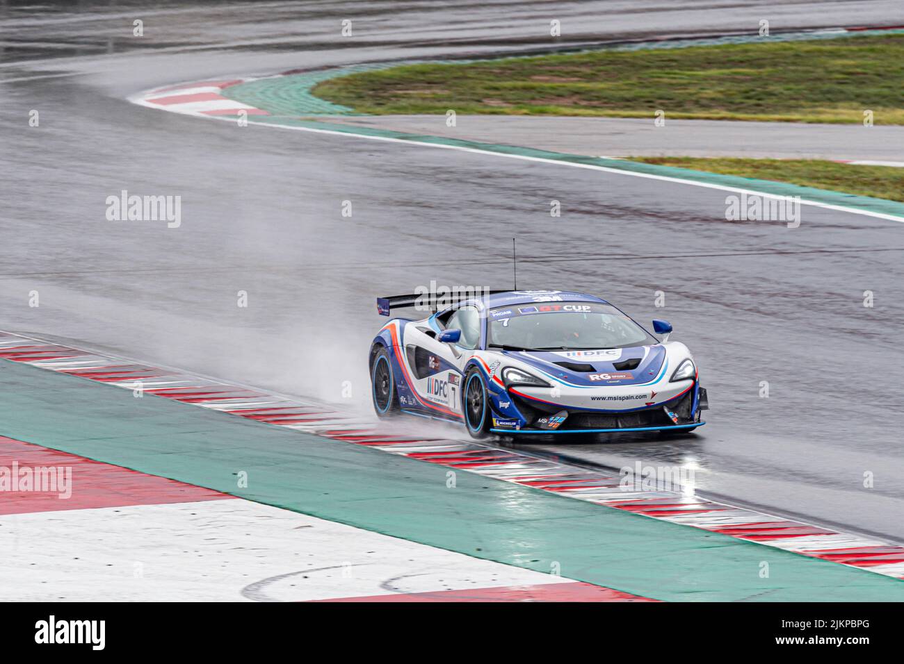 Super fast car in the track in cloudy and rainy day, McLaren 570s Stock ...