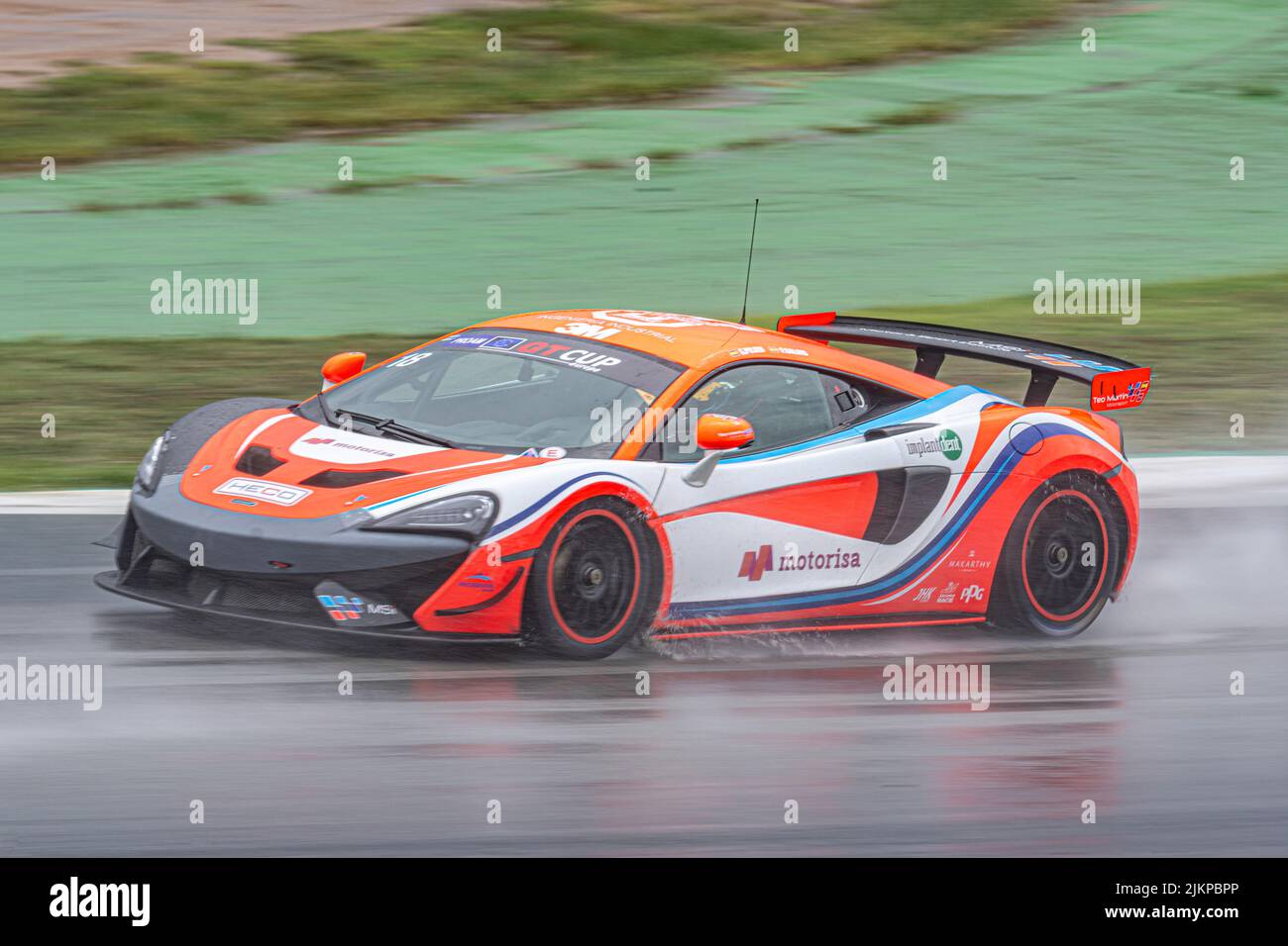 Super fast car in the track in cloudy and rainy day, McLaren 570s Stock ...