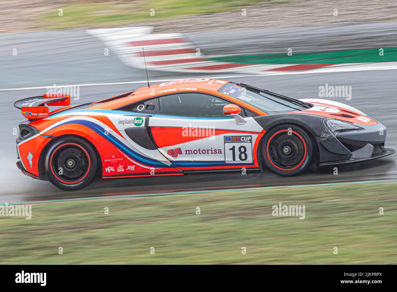 Super fast car in the track in cloudy and rainy day, McLaren 570s Stock ...