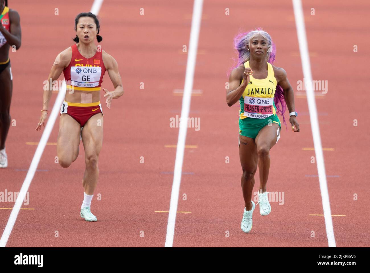 Shelly-Ann Fraser-Pryce (JAM) runs 10.87 ahead of Manqi Ge (CHN) 11.17 ...