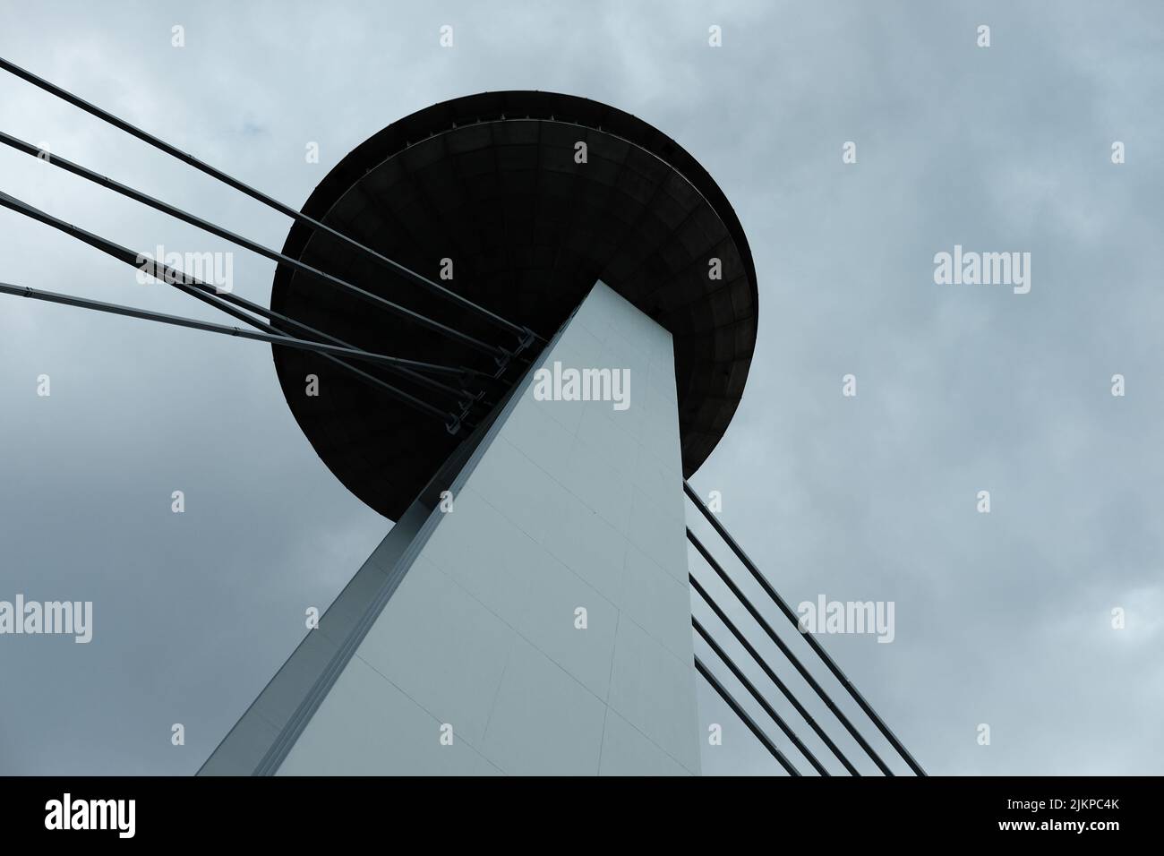 A bottom shot of a circle tower on a square-shaped column with some ...