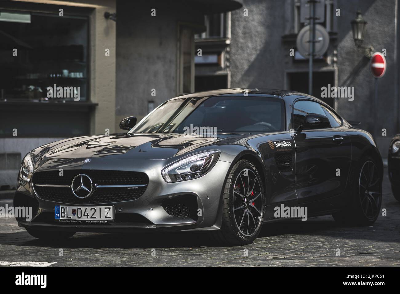 Modern gray fast car parked in the street. Mercedes Benz C120 AMG GT ...