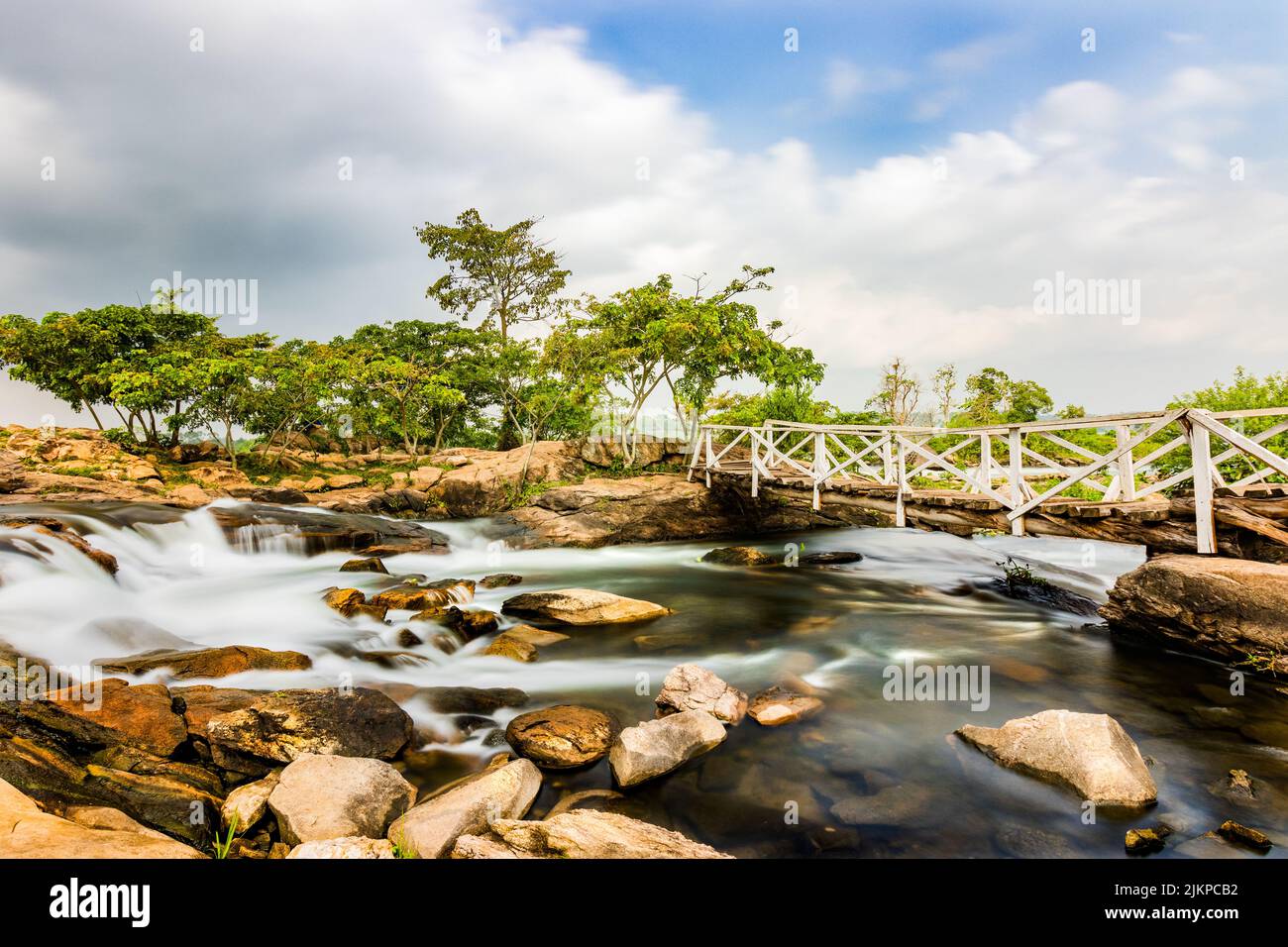A perspective shot of a bridge over a river in the rocky landscape ...