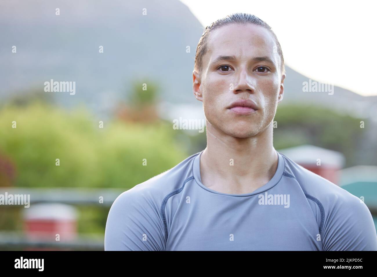Time to get my workout in. a young man taking a break during his ...