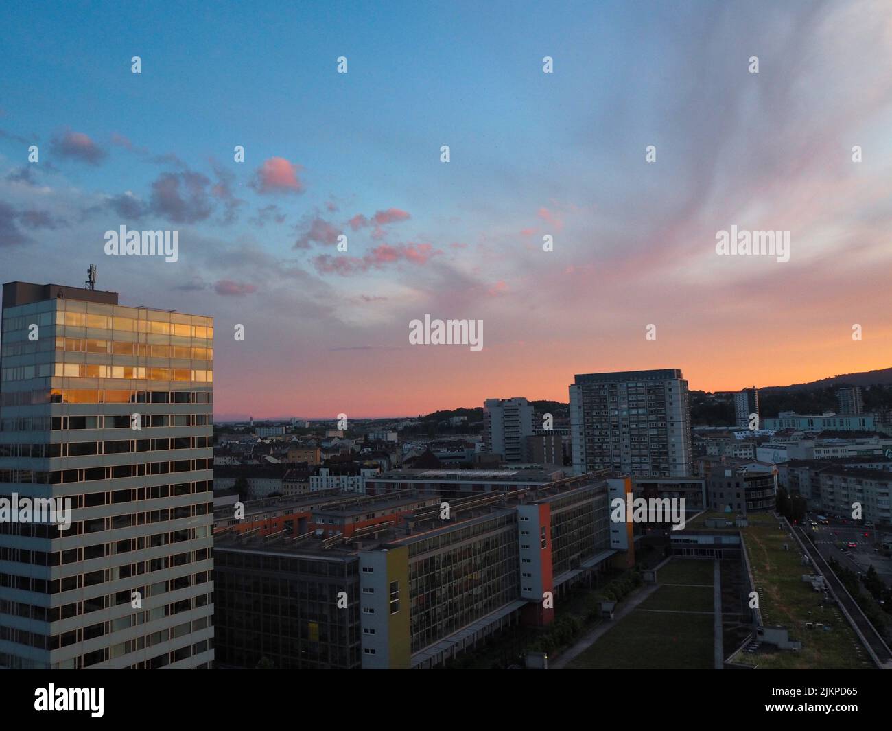 panoramic view of the city of Linz in sunset with beautiful small ...