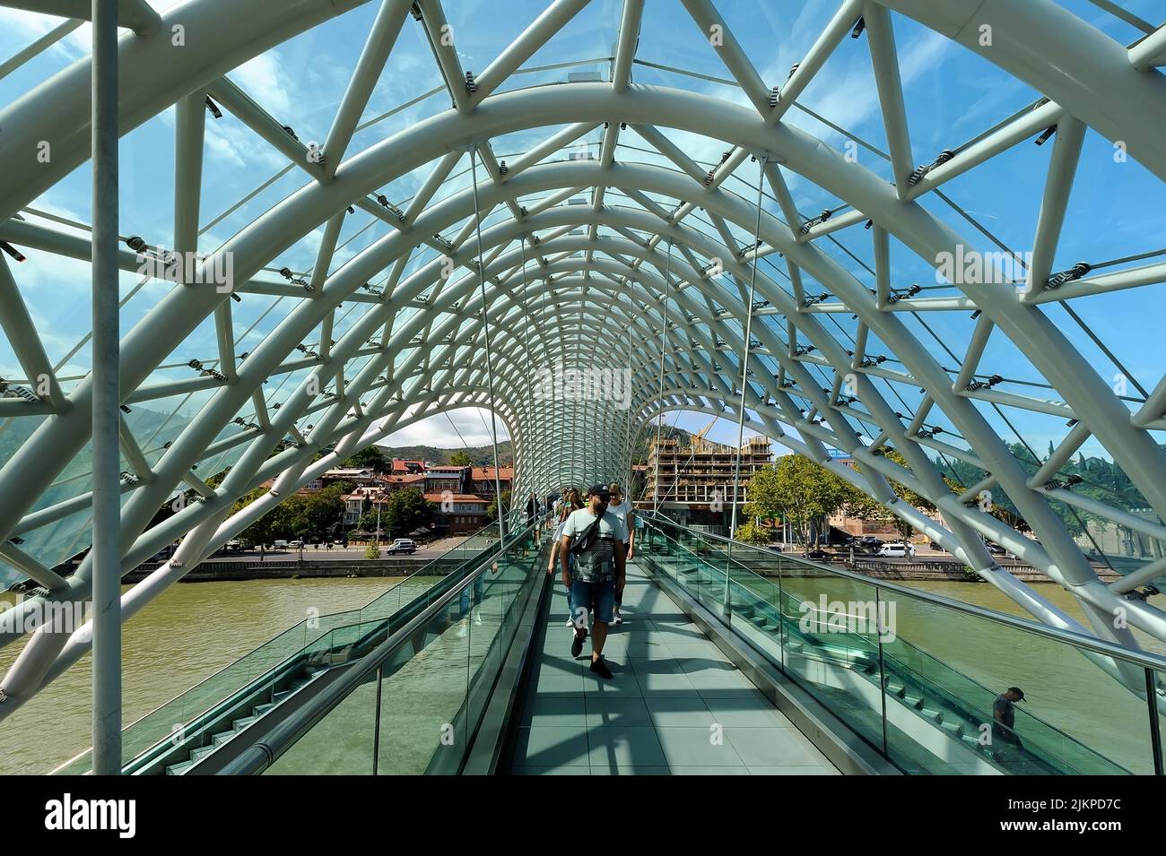 People on the bridge of Peace in Tbilisi Georgia Stock Photo - Alamy