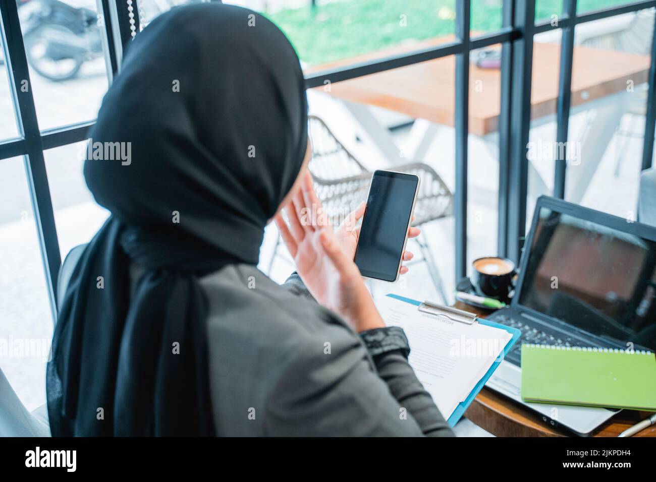 happy excited muslim woman suprised while looking at her phone Stock ...