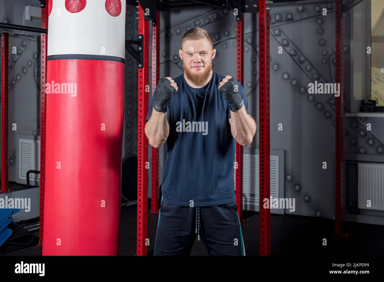 Young strong bearded man, mixed martial arts fighter and trainer ...