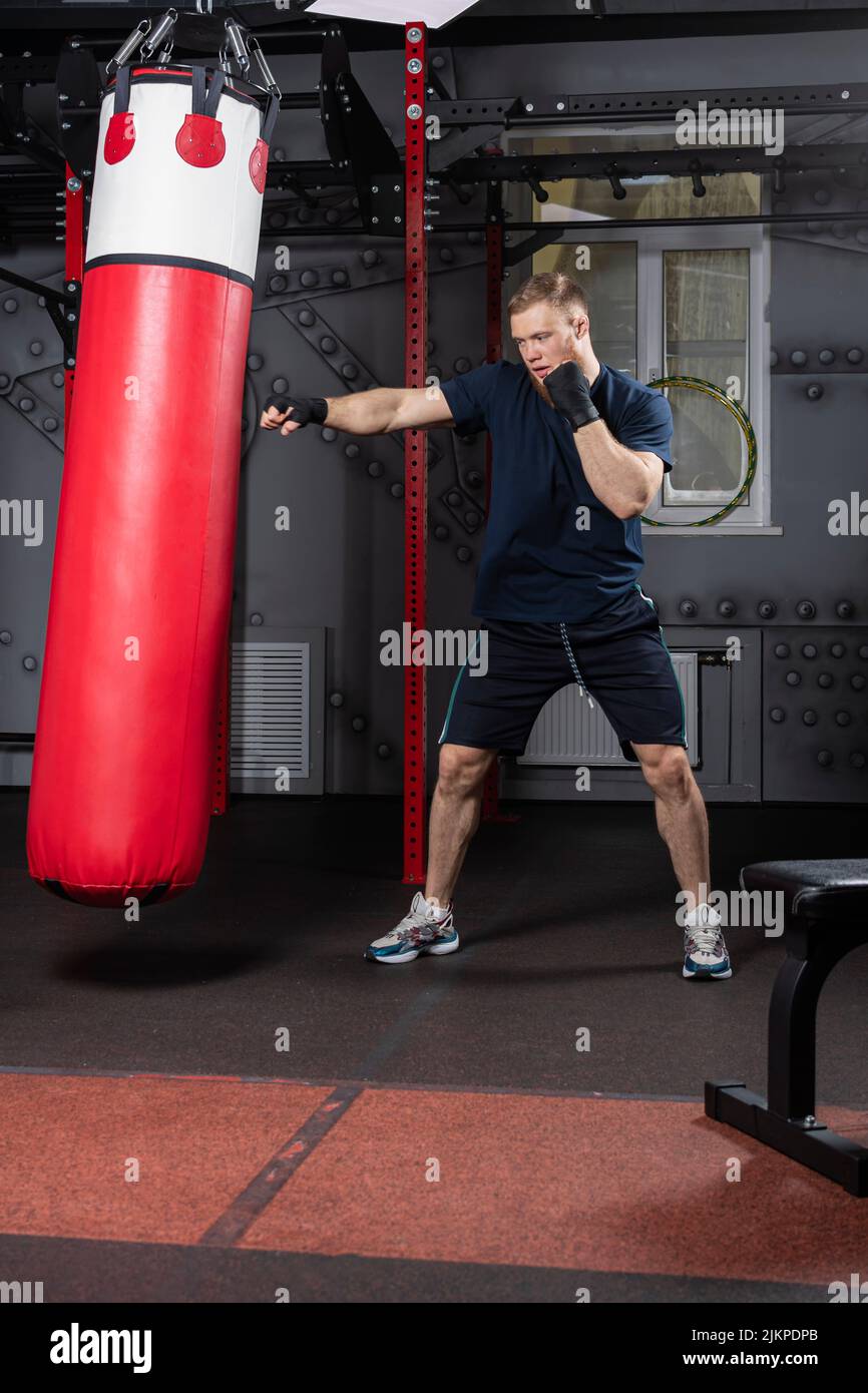 Young strong bearded man, mixed martial arts fighter and trainer ...