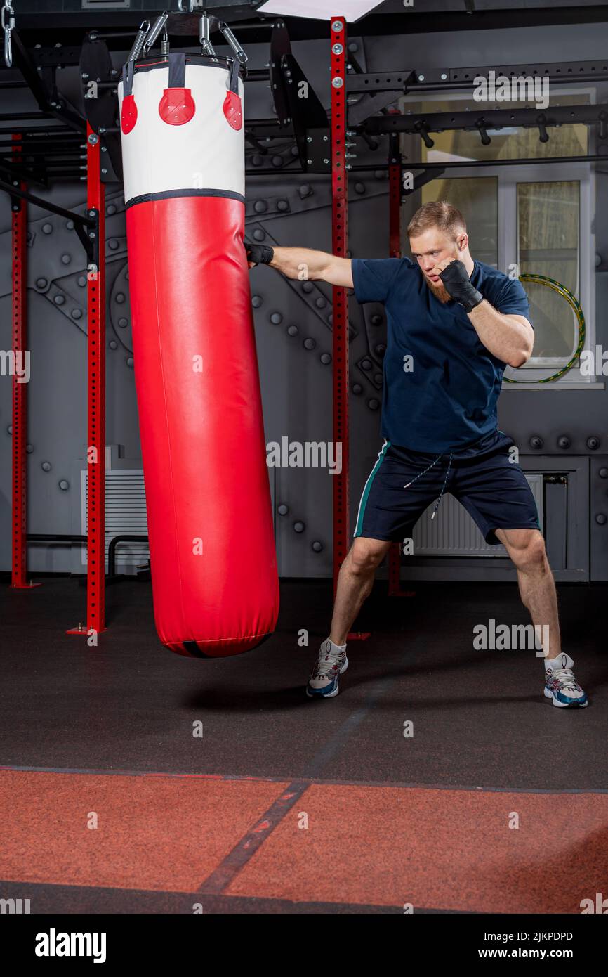 Young strong bearded man, mixed martial arts fighter and trainer ...