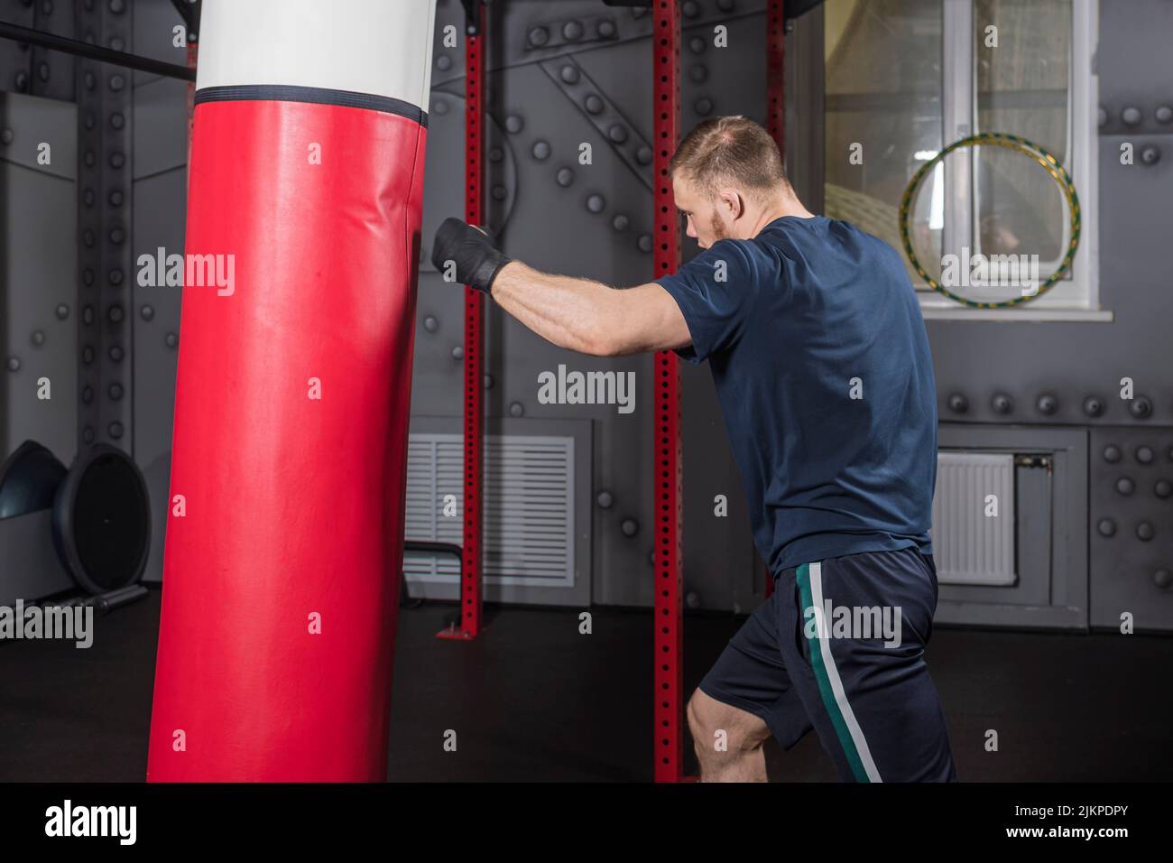 Young strong bearded man, mixed martial arts fighter and trainer ...
