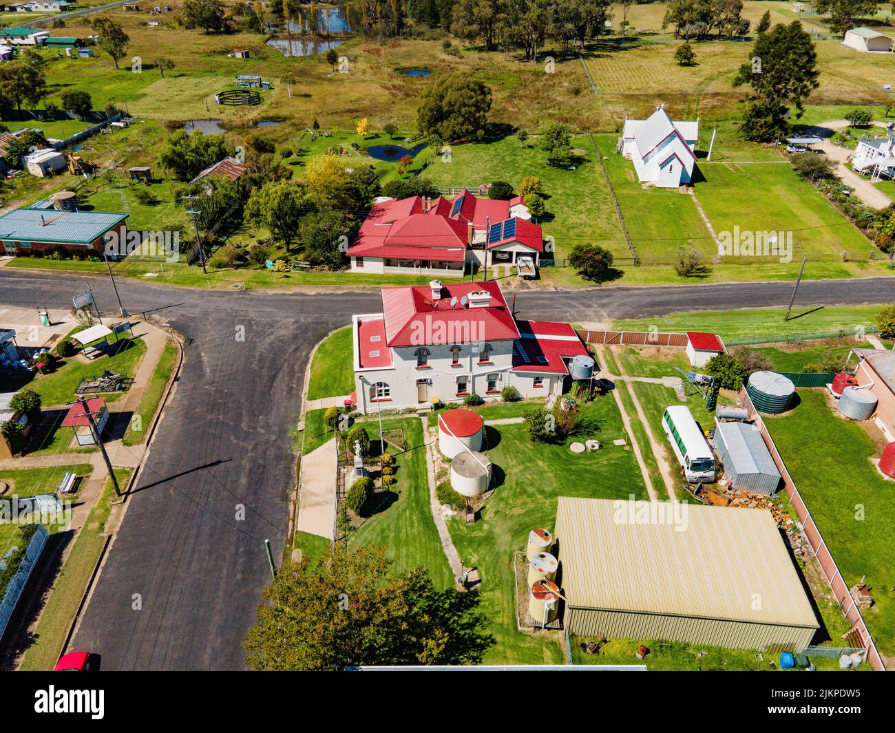 An aerial view of the small houses of Emmaville, Australia with vibrant ...