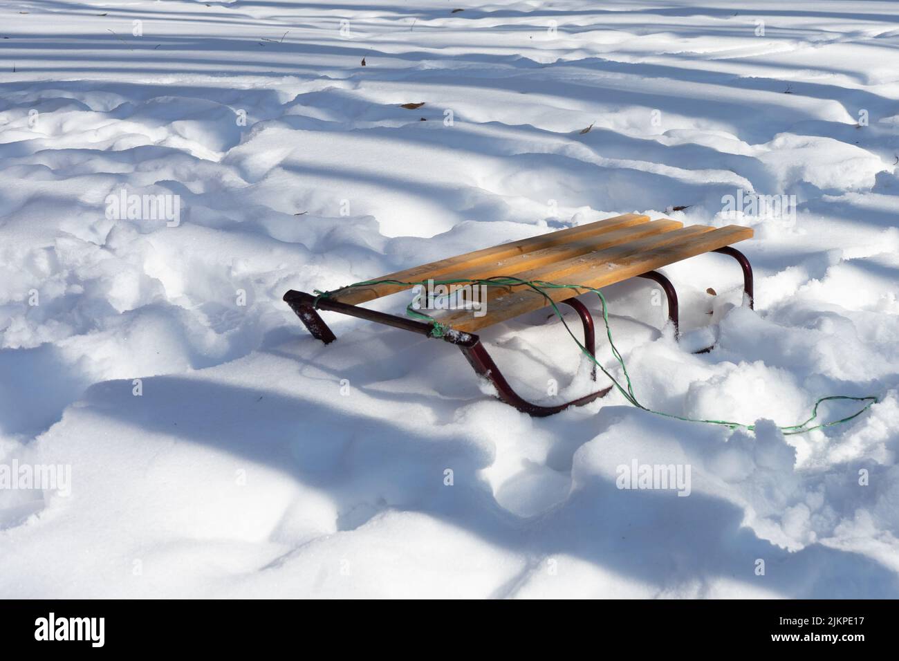 Children's sleds stand on deep, loose snow near the forest Stock Photo ...