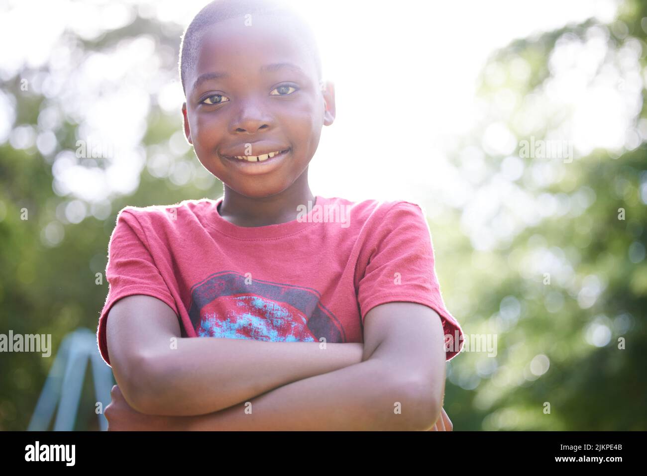 I wish I could play outside all day. a young boy relaxing outside Stock ...