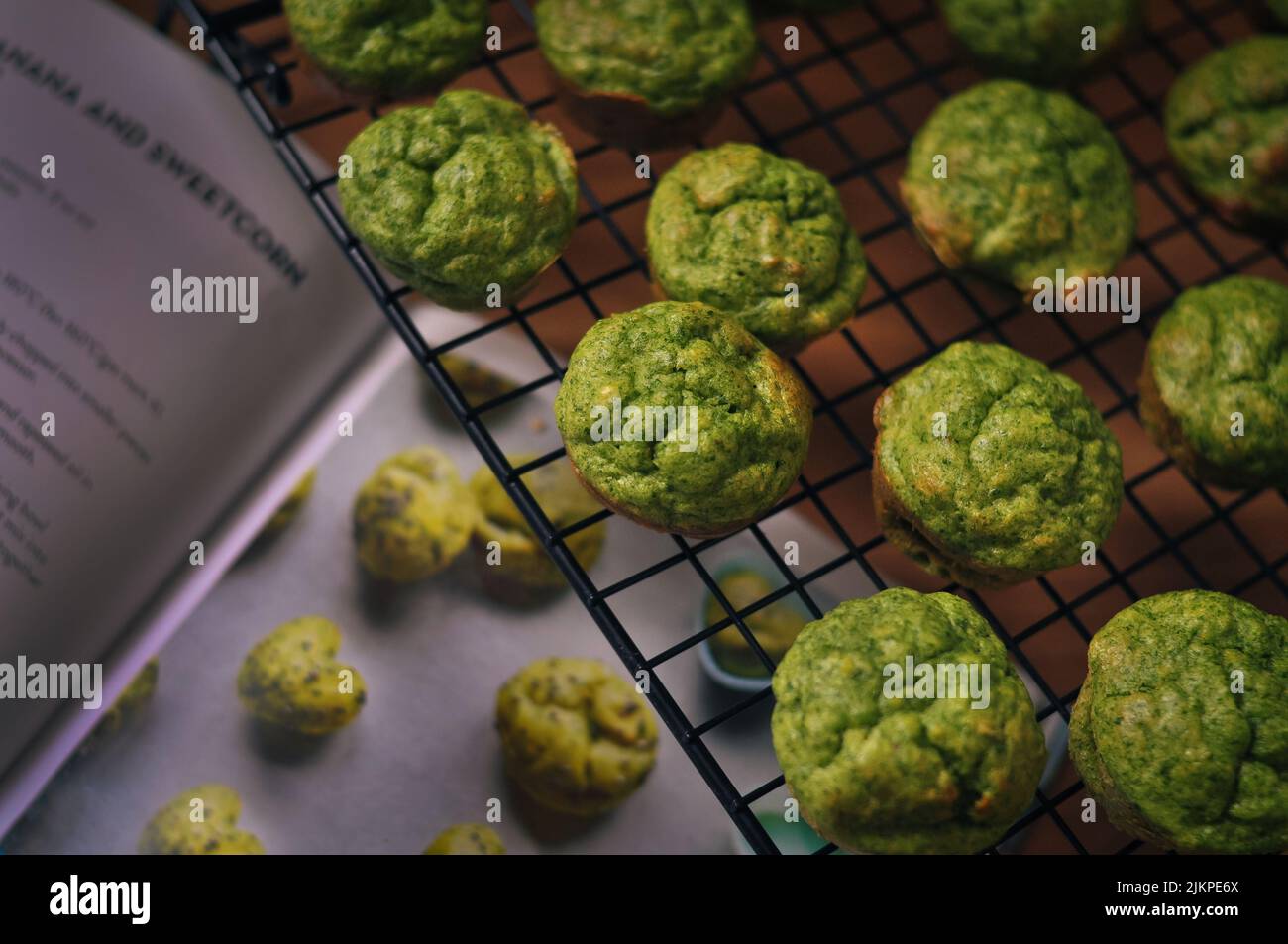 ready-made small green muffins with spinach on a baking sheet.healthy ...