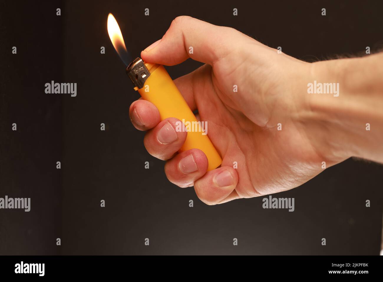Hand holding lighter cigarette lighter hi-res stock photography and ...