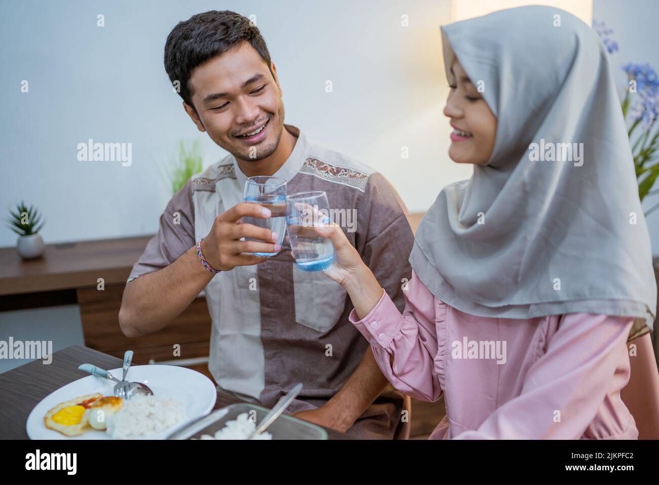 Muslim family having breakfast at home hi-res stock photography and ...