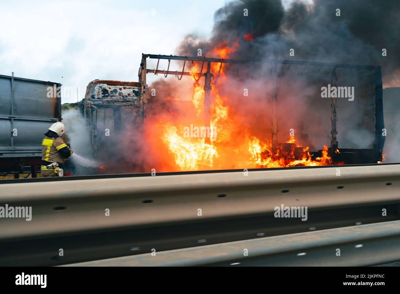 Car crash accident on a highway with damaged automobiles and smoke ...
