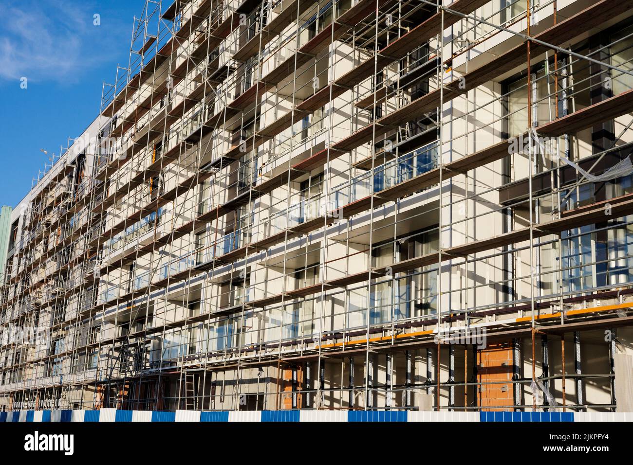 a fortified building under construction against a gray sky background ...