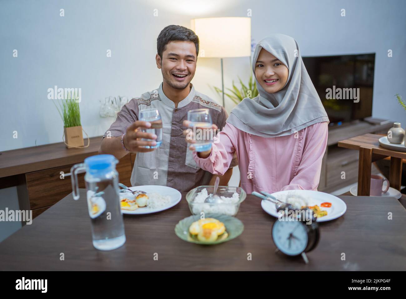 Muslim family having breakfast at home hi-res stock photography and ...