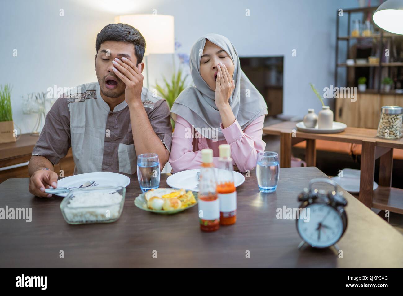 Muslim family having breakfast at home hi-res stock photography and ...