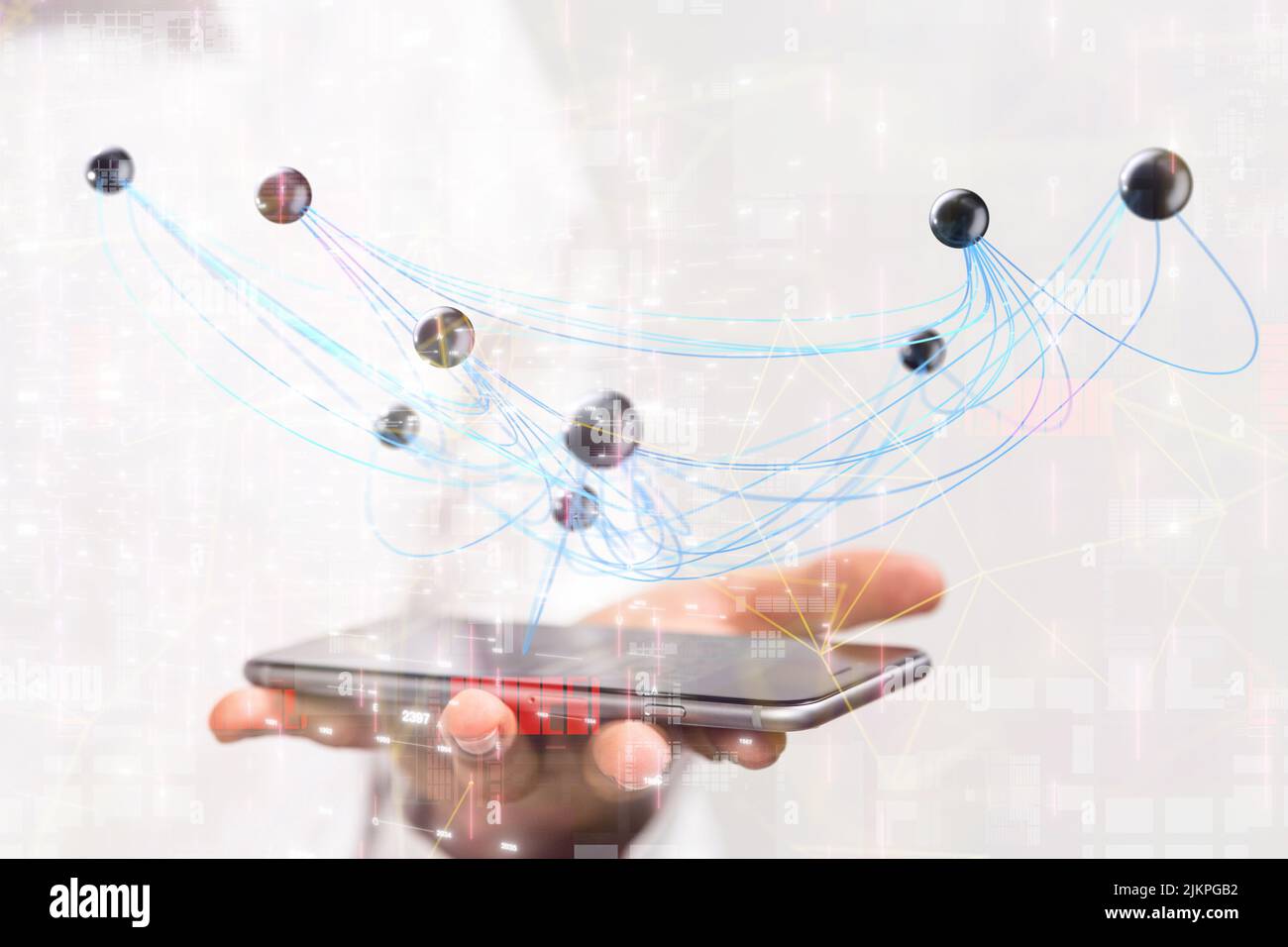 An illustrated network graphic with blue icons over a person's hand ...