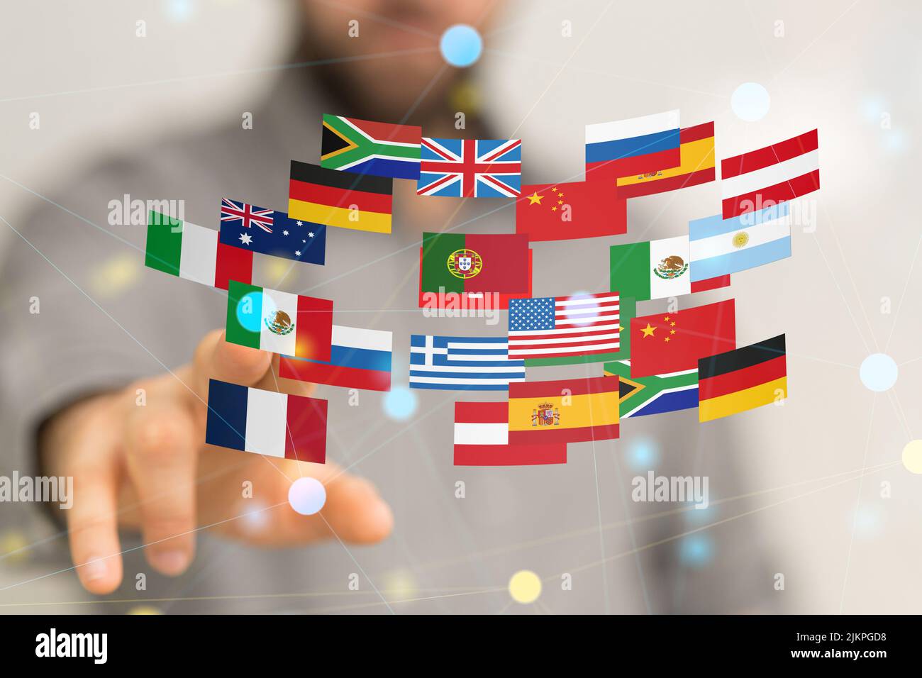 A 3D rendering of the world's national flags on a blurry background ...