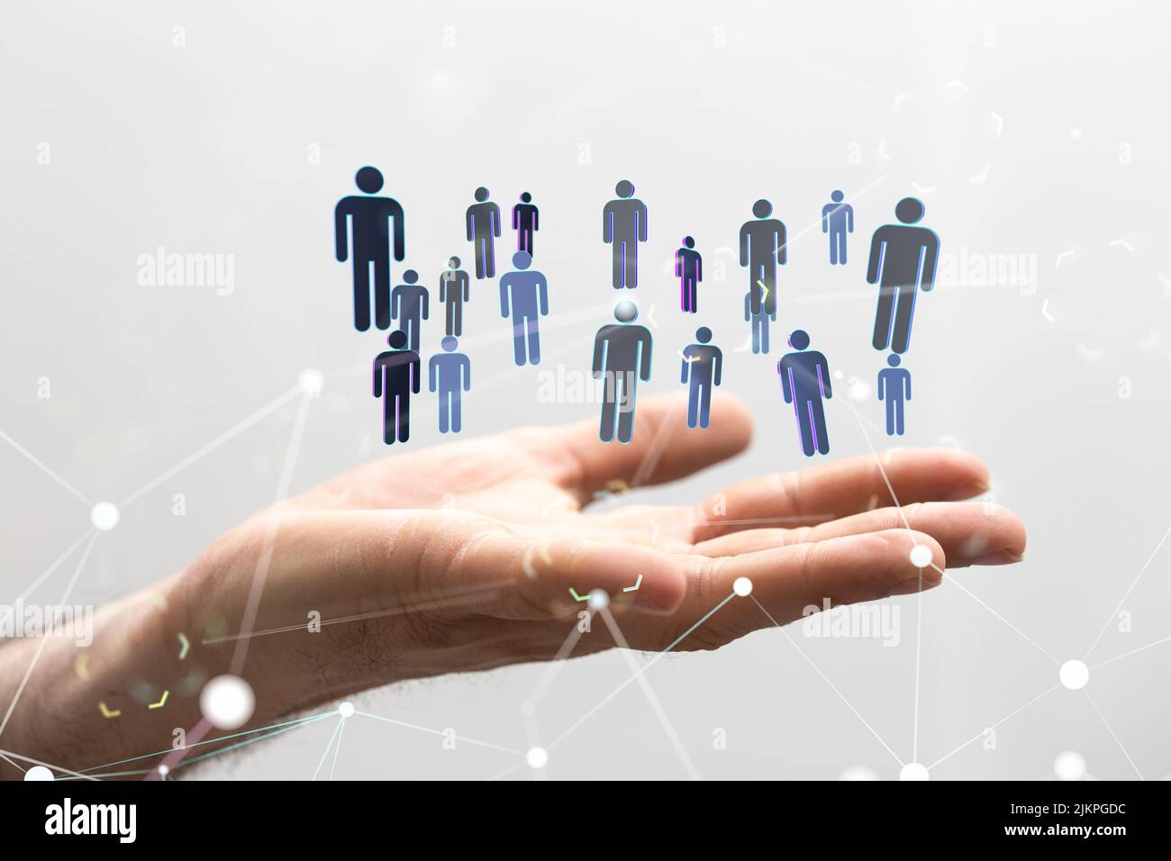 An illustrated network graphic with blue icons over a person's hand ...