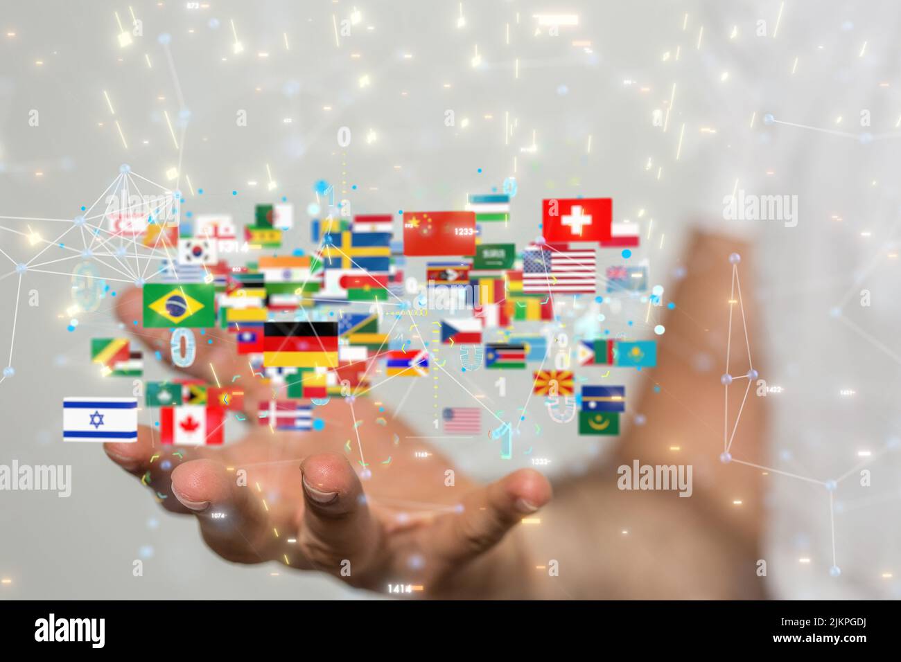 The flags of the world countries over a person's hand on a white ...