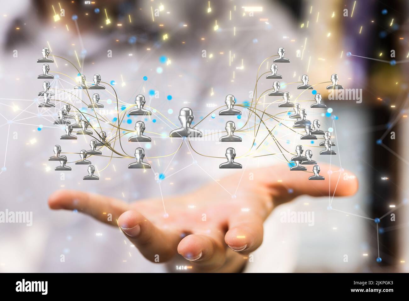 An illustrated network graphic with blue icons over a person's hand ...