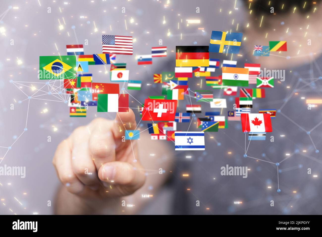 A 3D rendering of the world's national flags on a blurry background ...