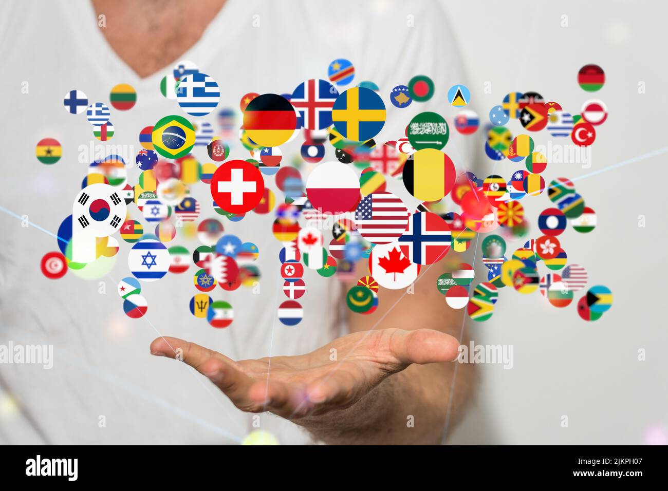A 3D rendering of the world's national flags on a blurry background ...