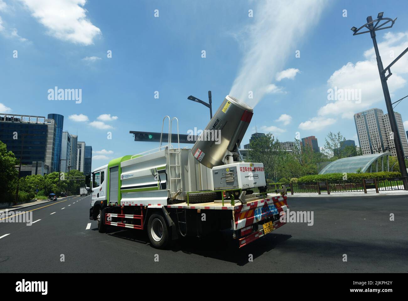 HANGZHOU, CHINA - AUGUST 3, 2022 - A large fog gun truck sprays water ...