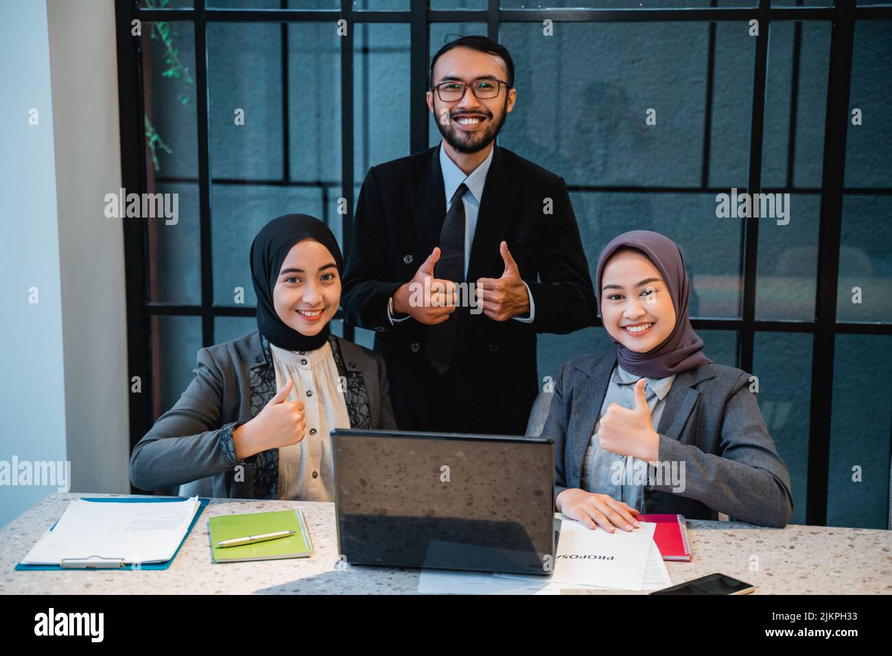 Business team showing thumb hi-res stock photography and images - Alamy