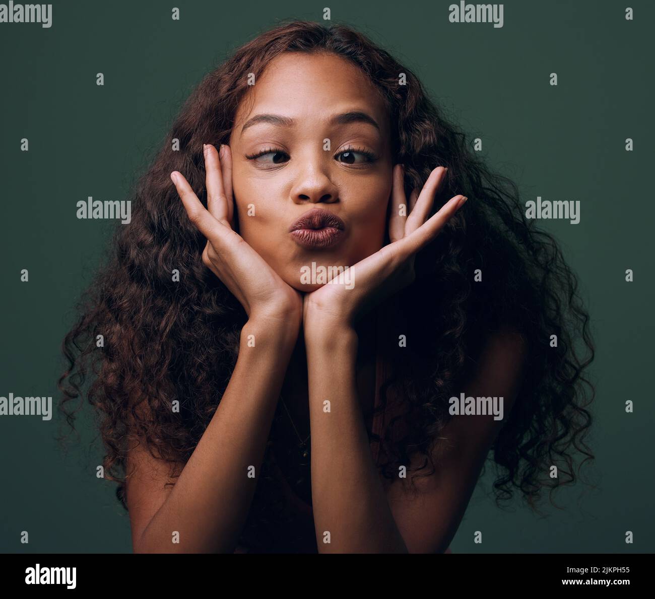 Kiss me Im crazy. Cropped portrait of an attractive and quirky young ...