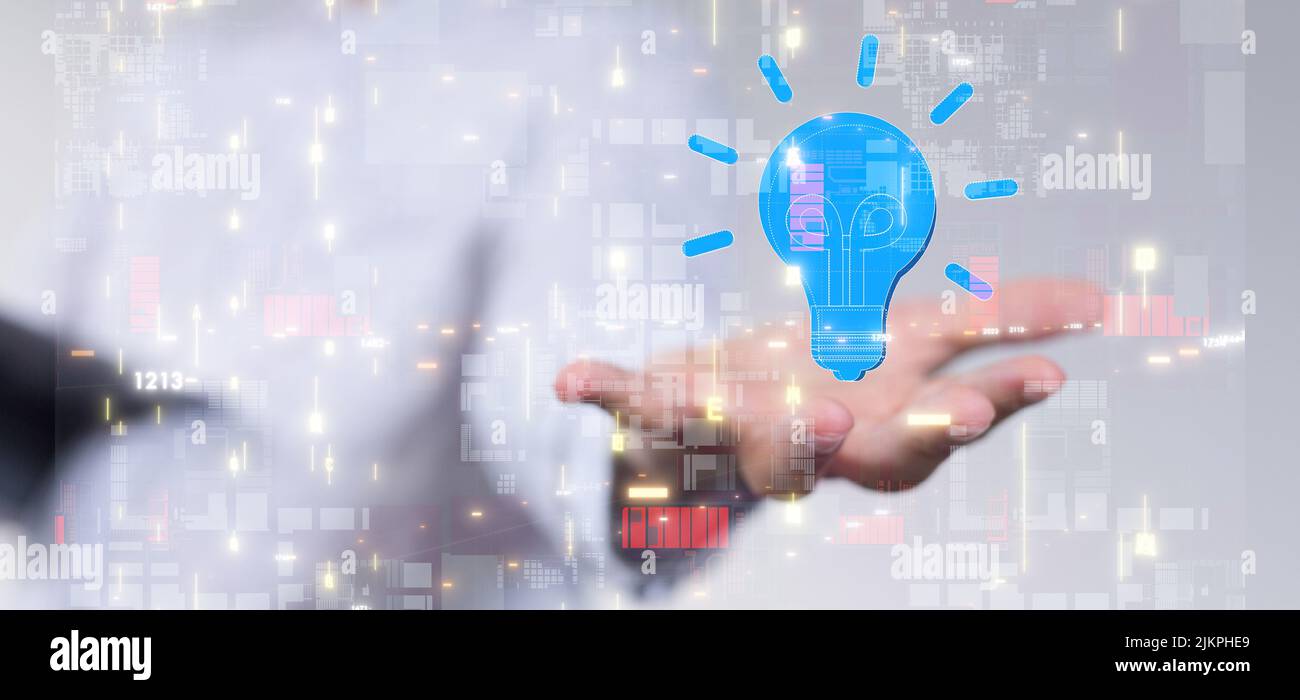 A hand reaching out to an illustrated lightbulb with code particles ...