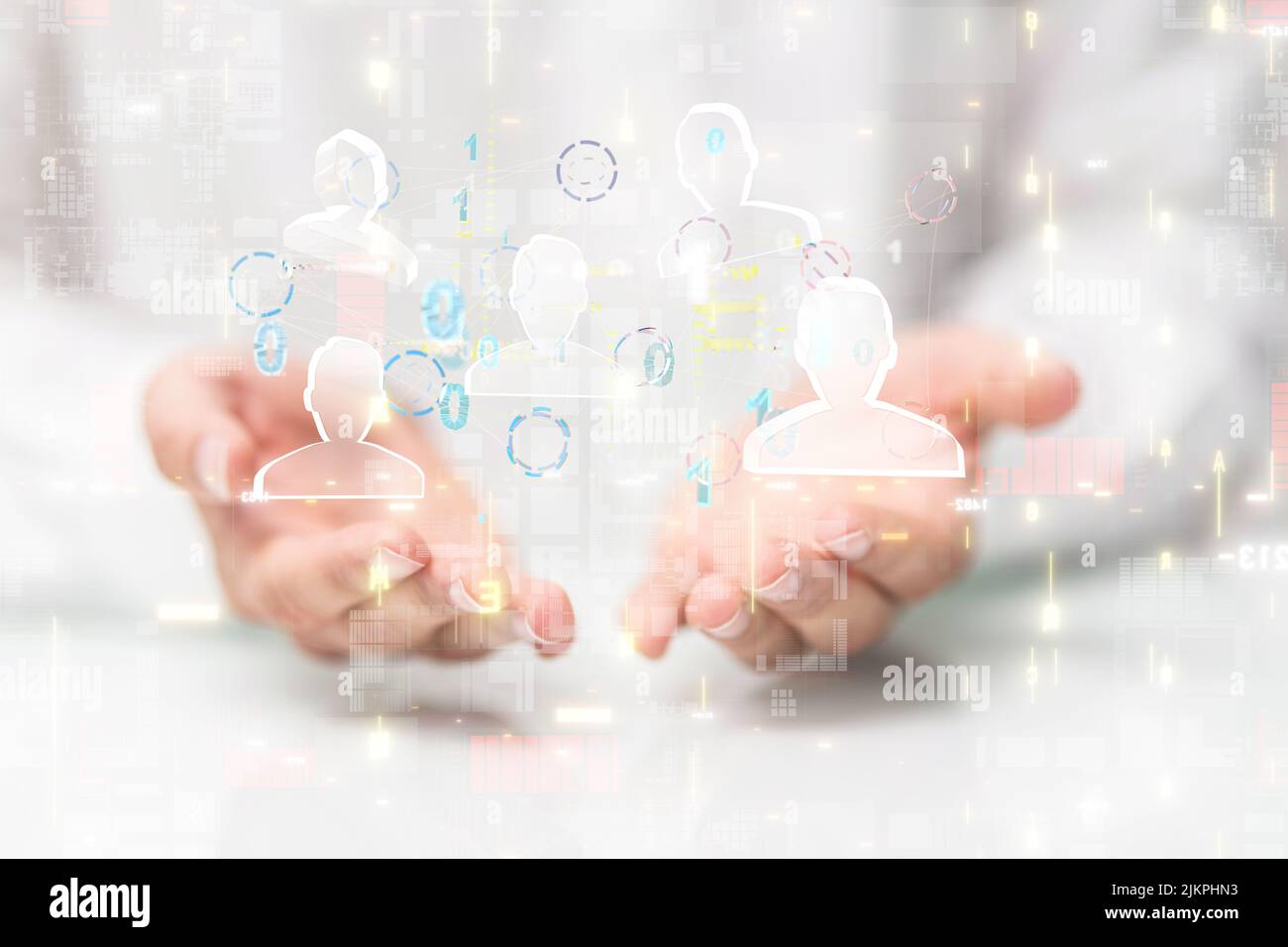 A closeup of hands holding 3D rendered connected cells and human icons ...