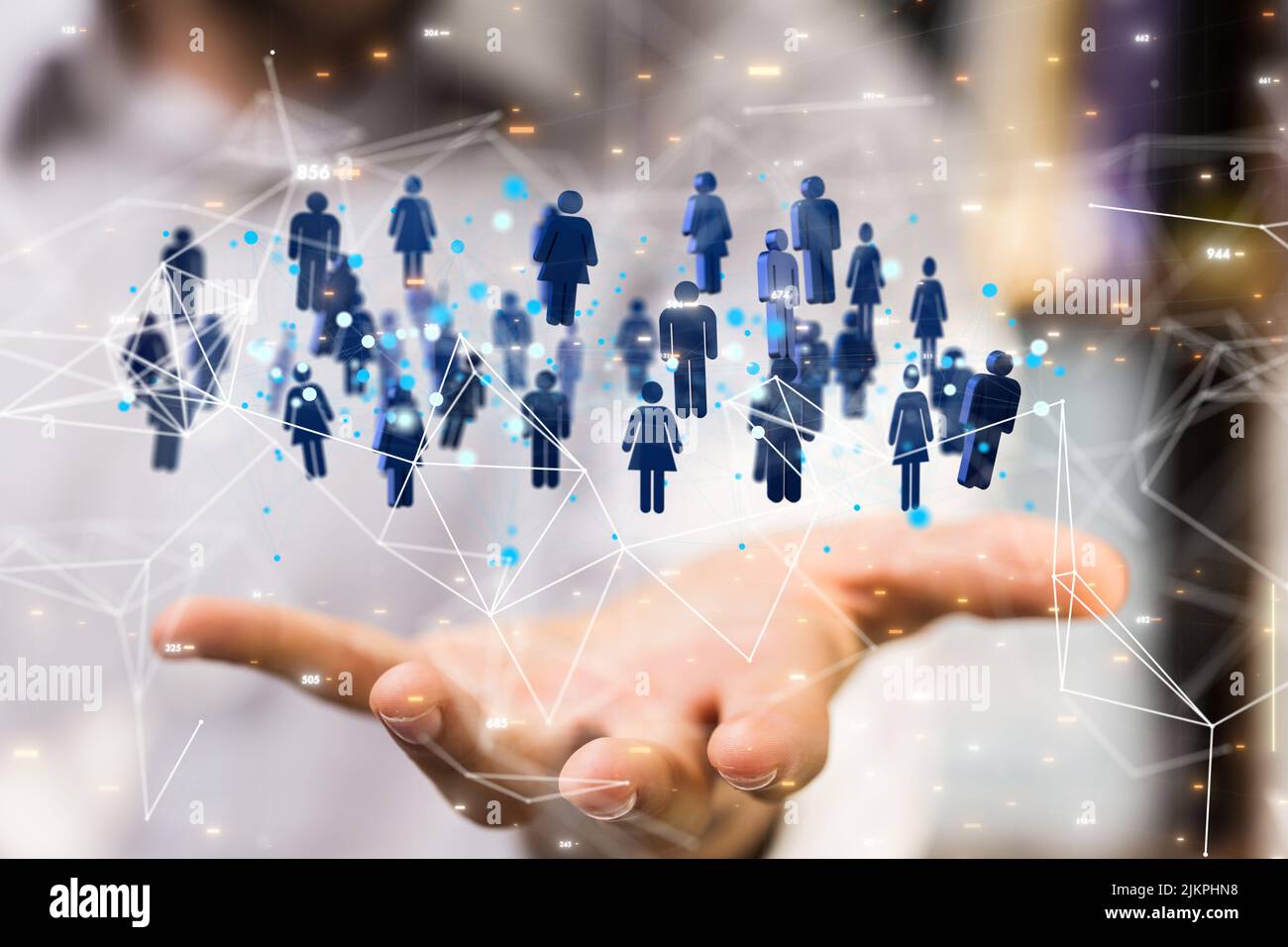 A hand holding 3D rendered human icons connected with dots, a digital ...
