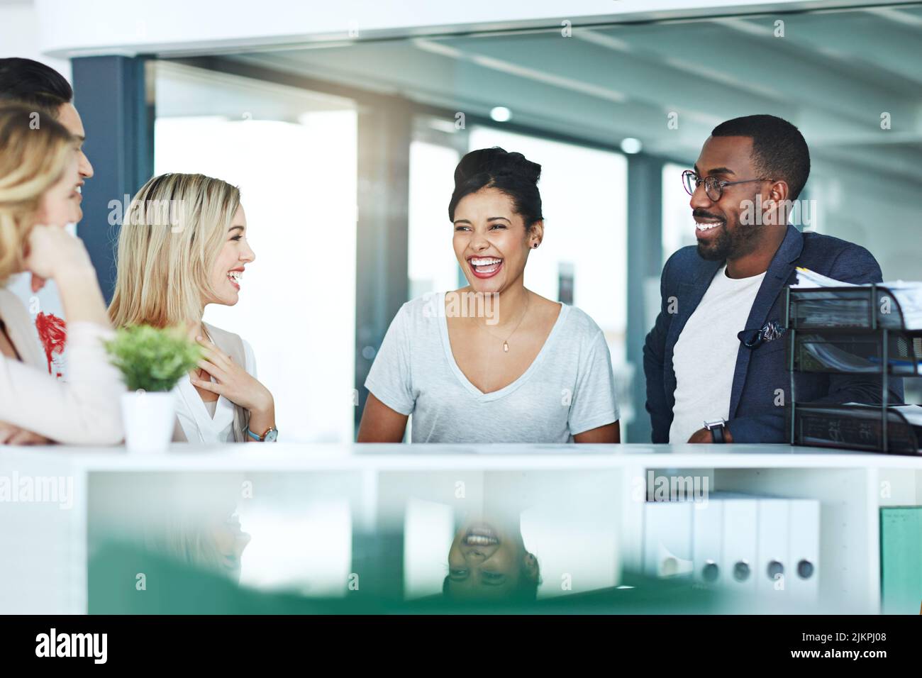 Group of business people talking and having a friendly discussion at ...