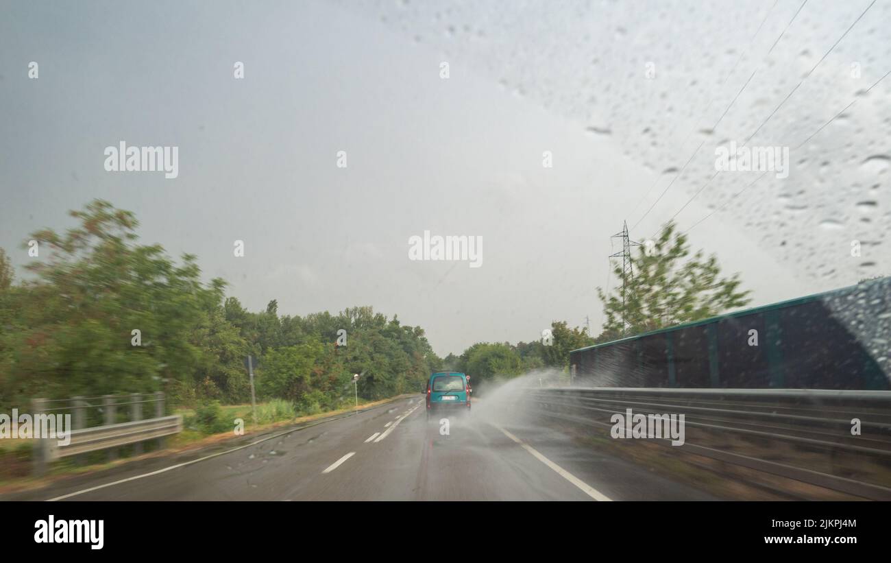 driving rainy day car interior view, raining outside car while on road ...