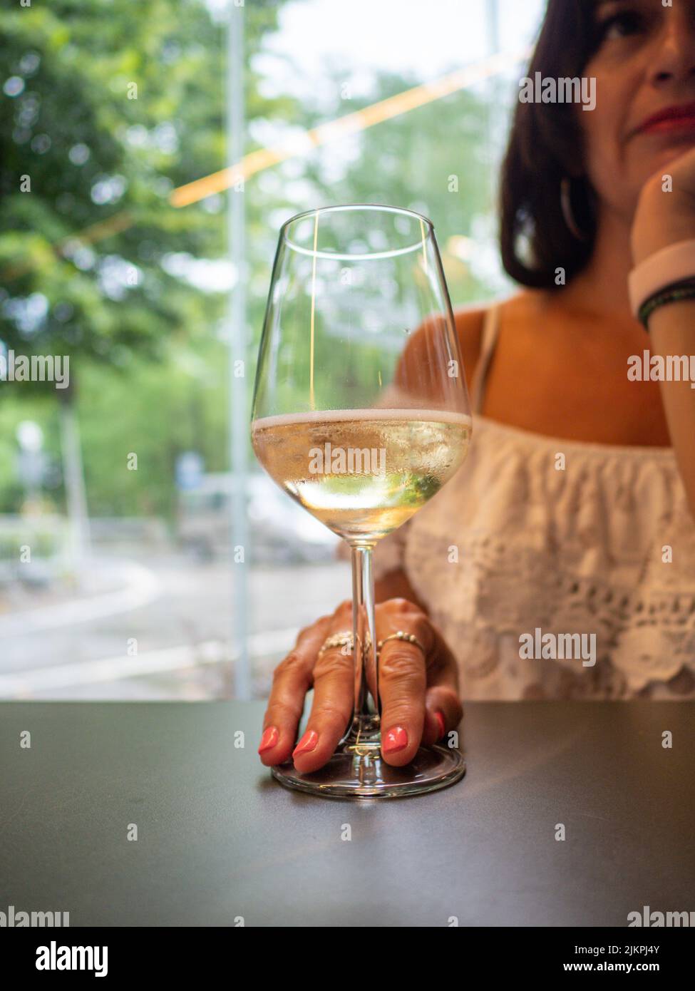 female lady having prosecco in a bar outdoors Stock Photo - Alamy