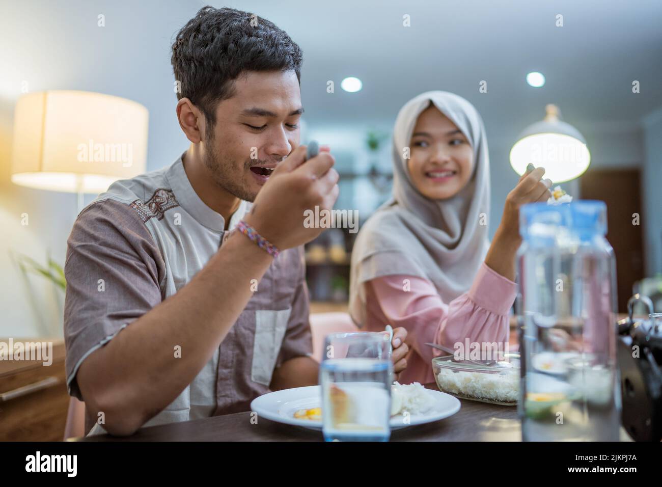 Muslim family having breakfast at home hi-res stock photography and ...