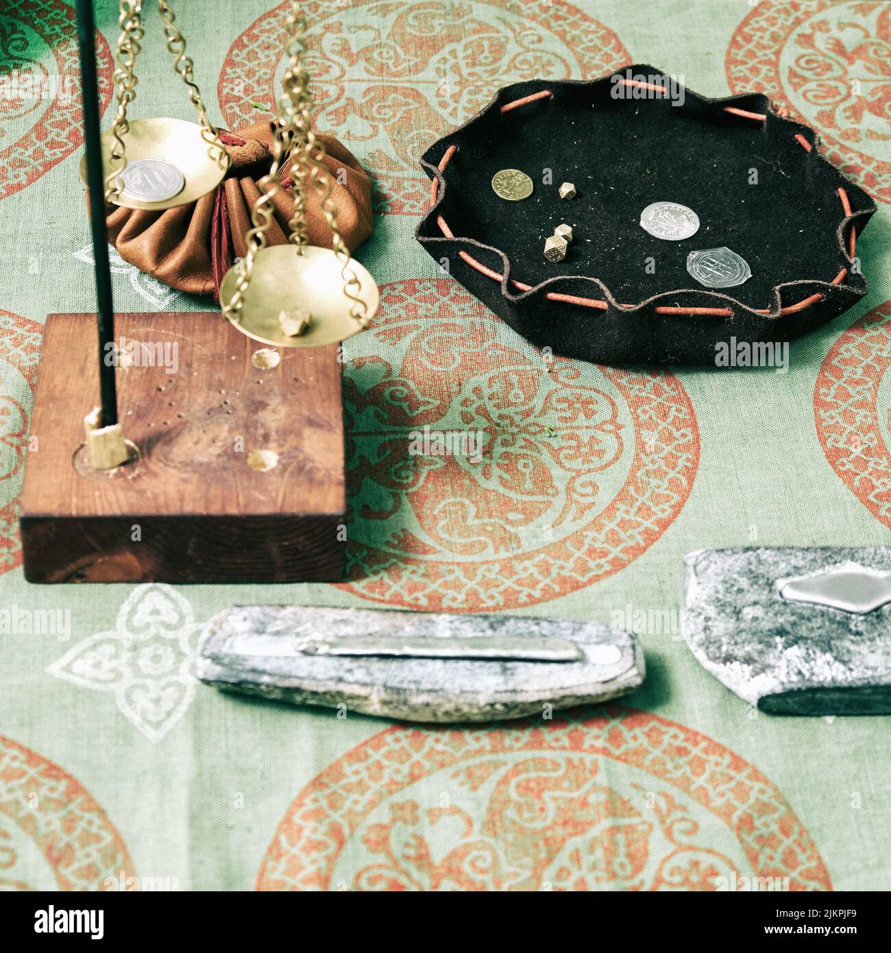 Production of medieval coins by casting and forging. Reconstruction of ...