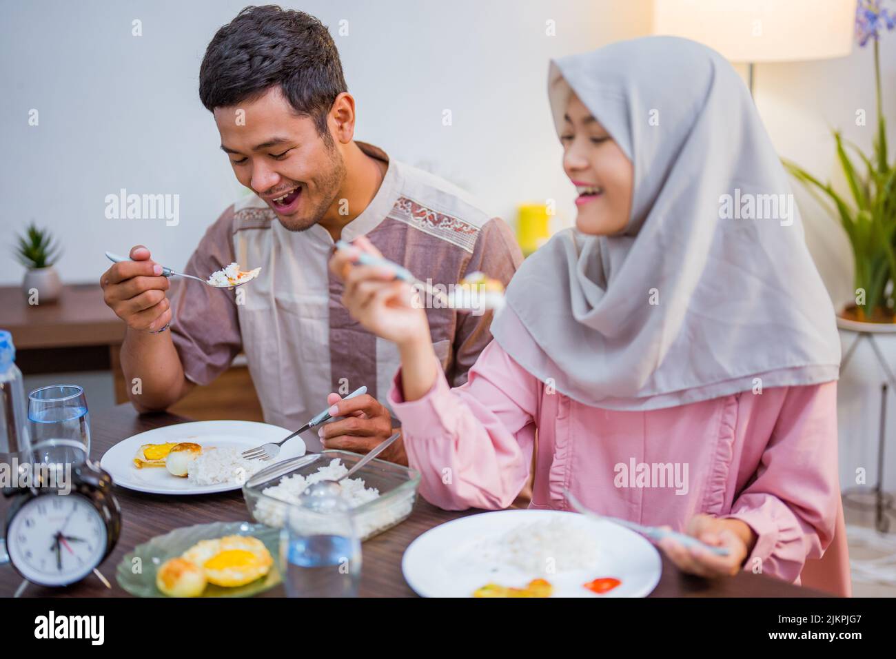 Muslim family having breakfast at home hi-res stock photography and ...