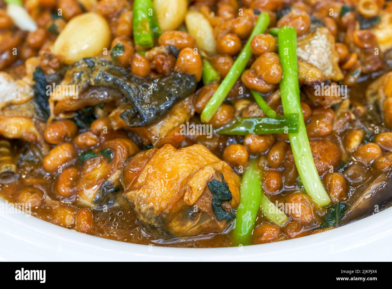 A delicious Chinese dish, braised bullfrog with soybeans Stock Photo ...