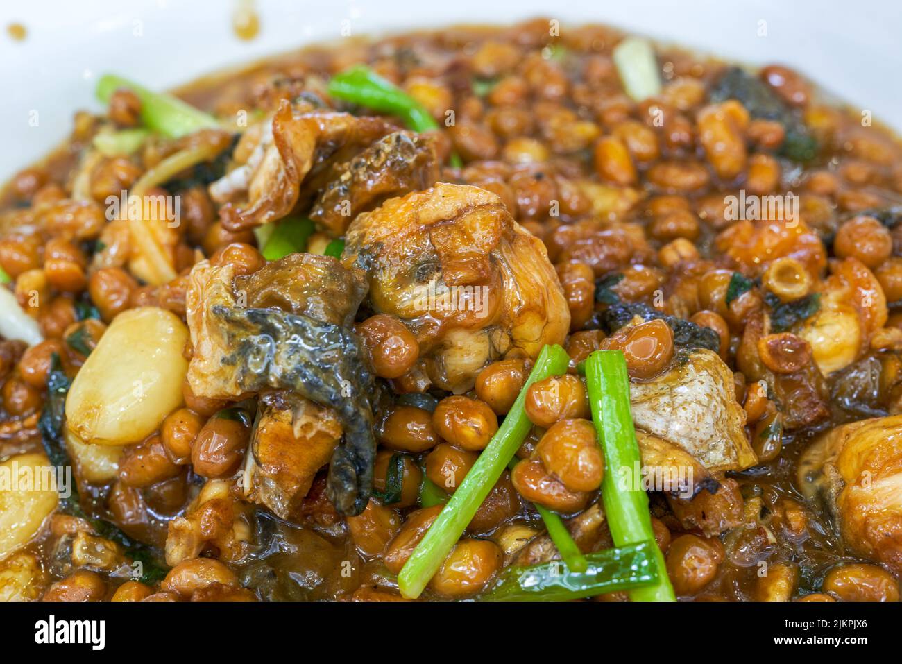 A delicious Chinese dish, braised bullfrog with soybeans Stock Photo ...