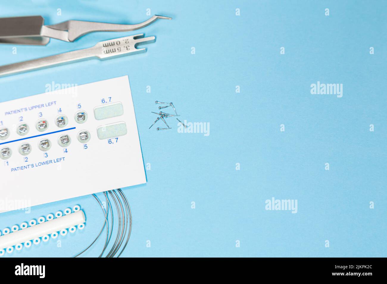 a set of special tools for an orthodontist to install braces for a ...