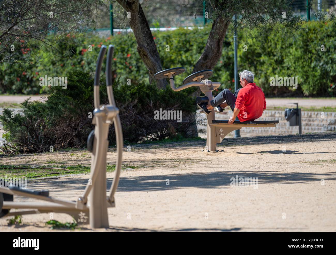 An old man doing physical activities in the garden in daylight Stock ...